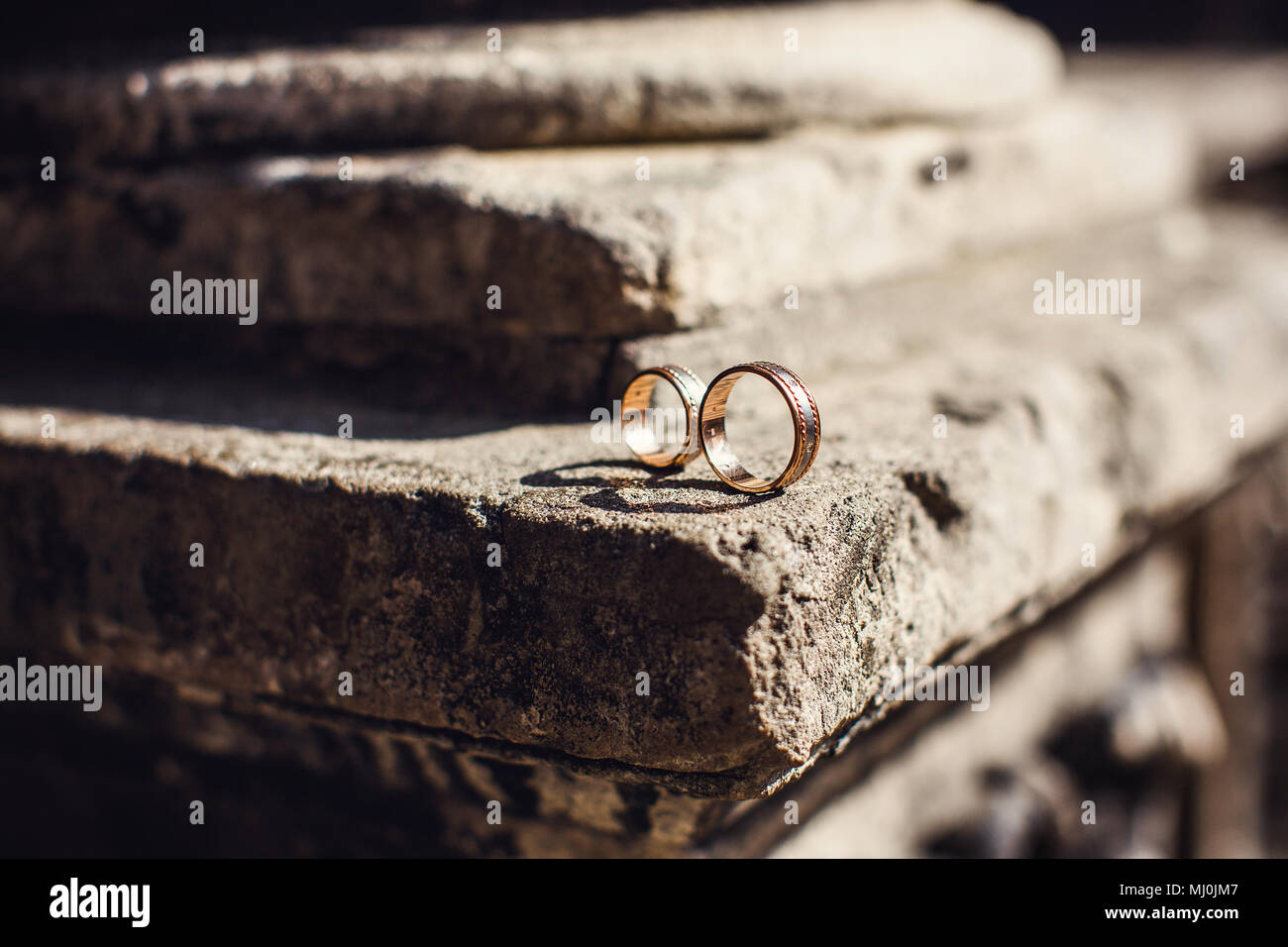 stylish golden wedding rings, space for text Stock Photo - Alamy