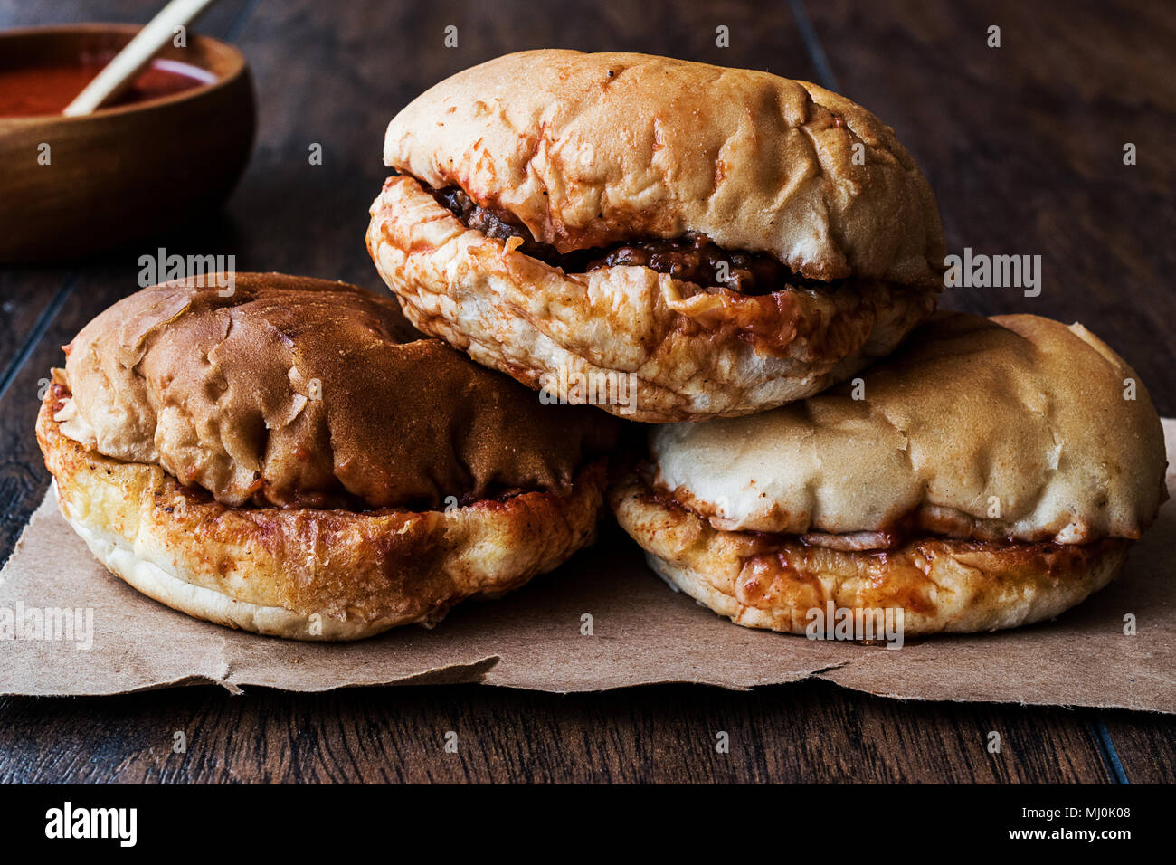 Turkish Wet Burger with sauce / islak hamburger on a wooden surface ...