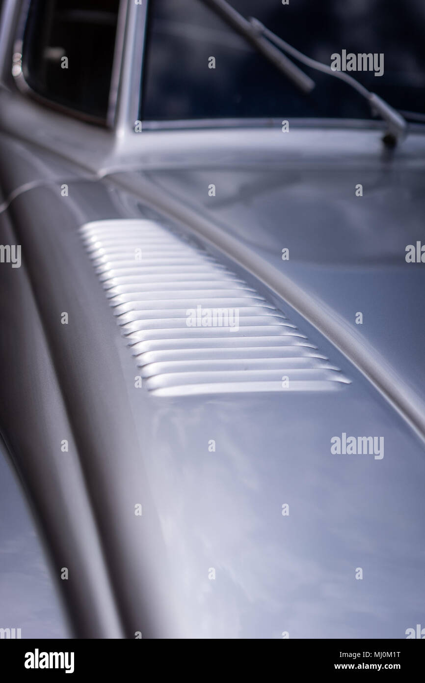 A close up look at an old classic grey car. Retro automobile exterior ...