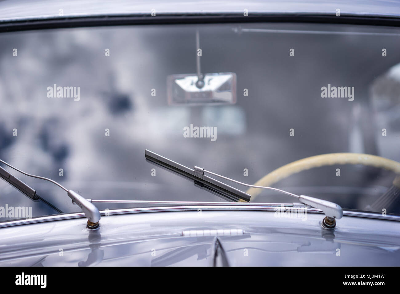 A close up look at an old classic grey car. Retro automobile exterior ...