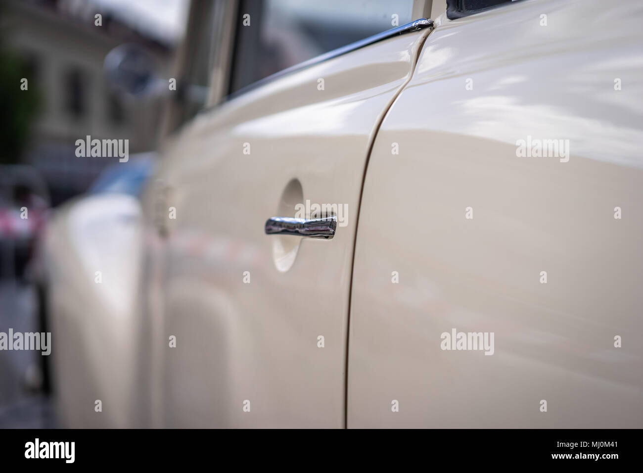 A close up look at an old classic white car. Retro automobile exterior ...