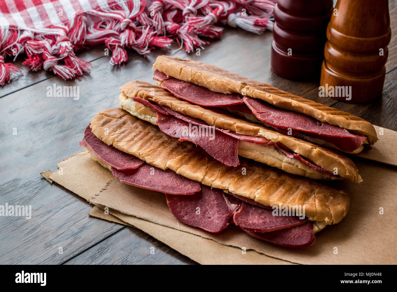 Dilli Kasarli / Beef Tongue Sandwich on a wooden surface Stock Photo ...