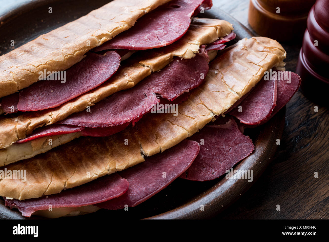 Dilli Kasarli / Beef Tongue Sandwich on a wooden surface Stock Photo ...