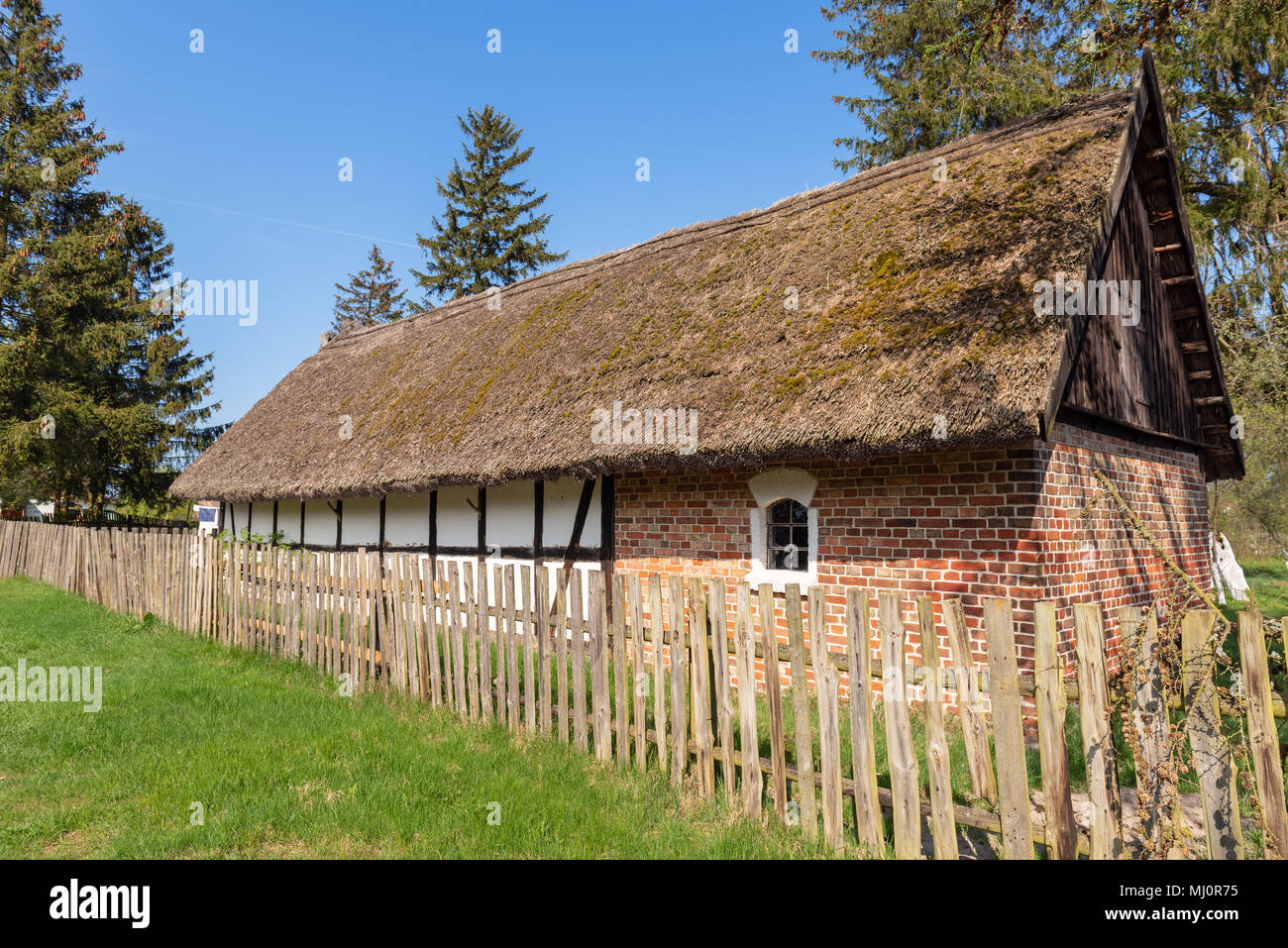 Typical traditional Polish country thatched house in Kluki village ...