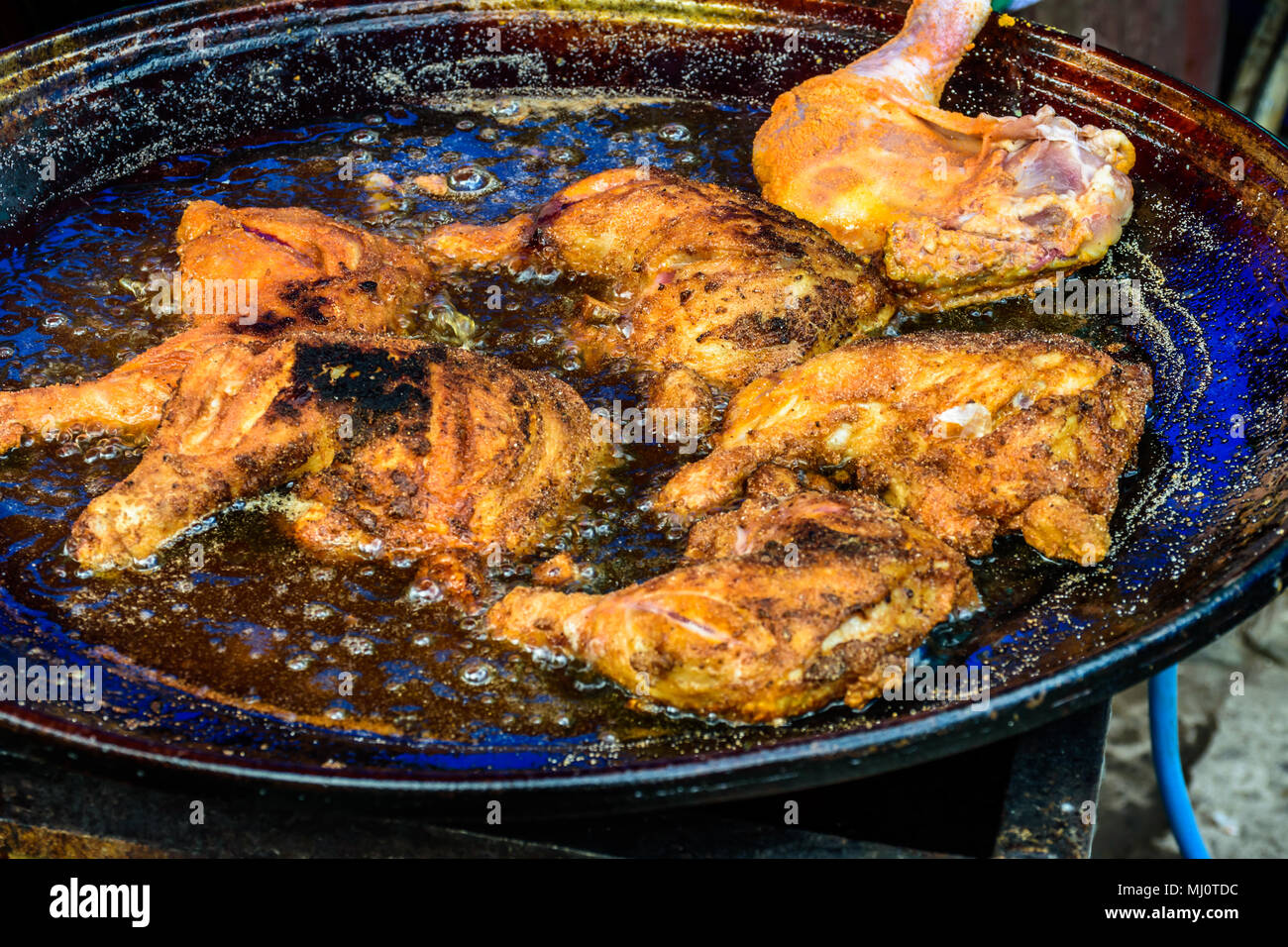 Local fries chicken at streetside food stall during the giant kite ...