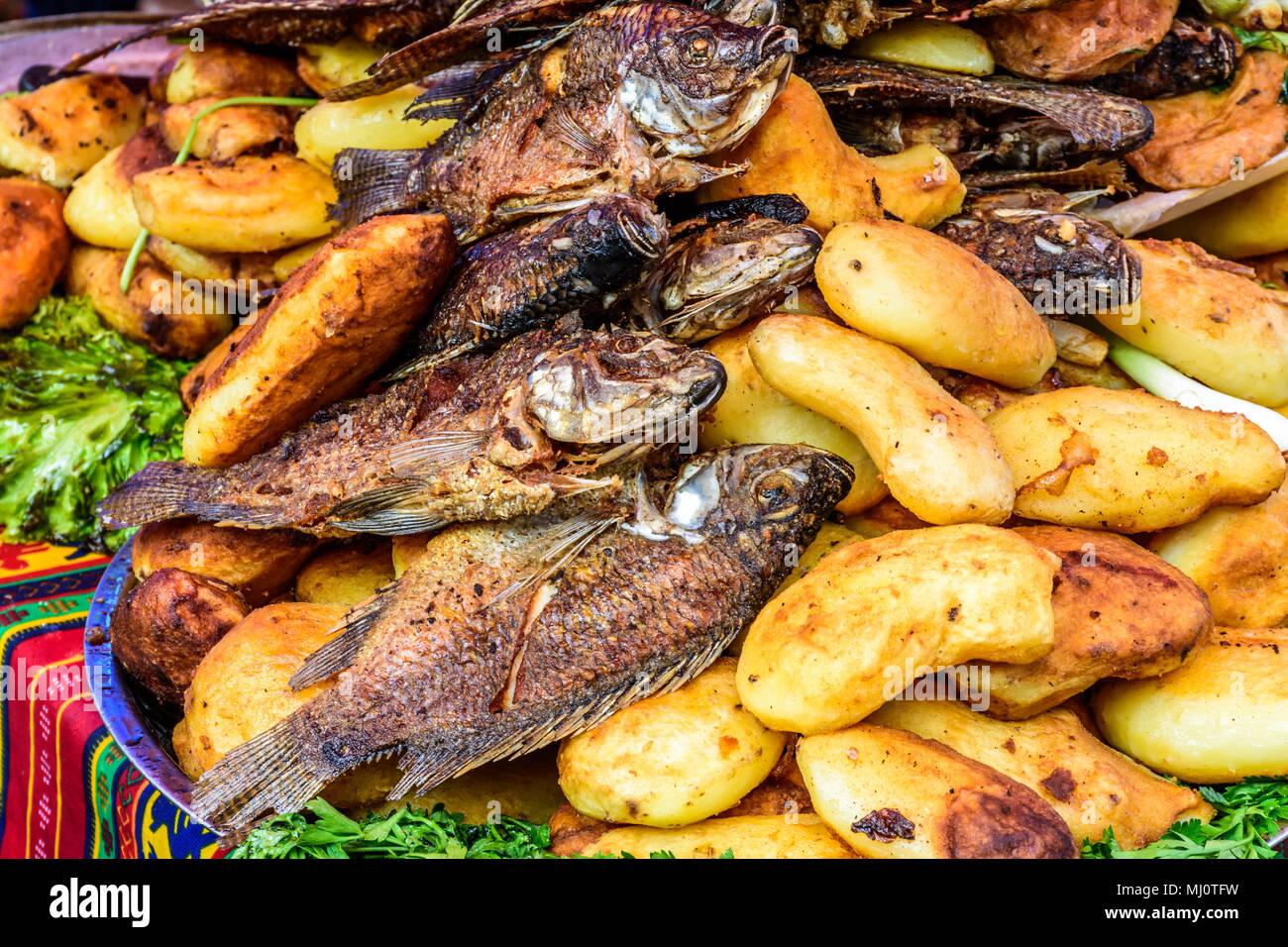 Fried fish & potatoes on streetside food stall during the giant kite ...