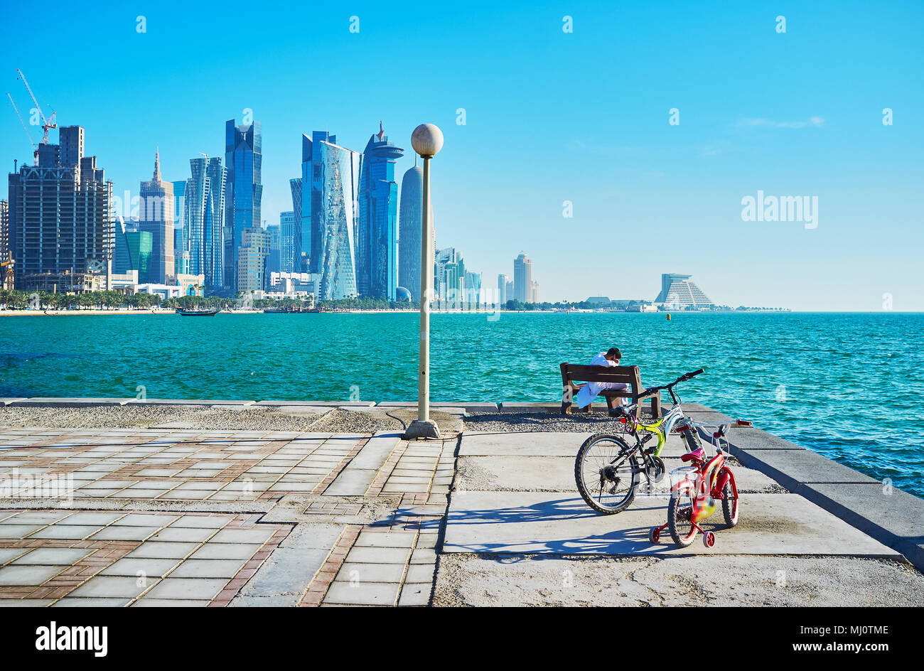 The walk on Corniche promenade with a view on the streetlight, parked ...