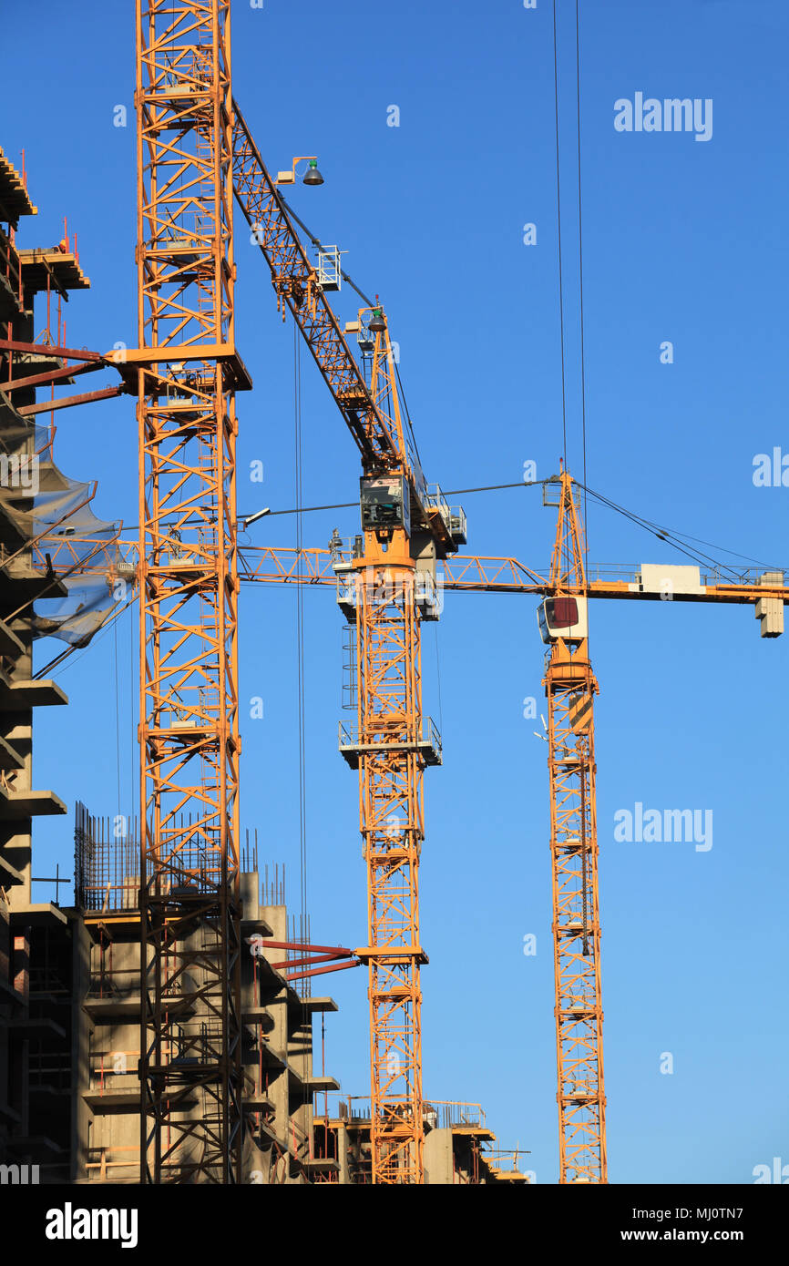 tower cranes on the construction of high-rise buildings Stock Photo - Alamy