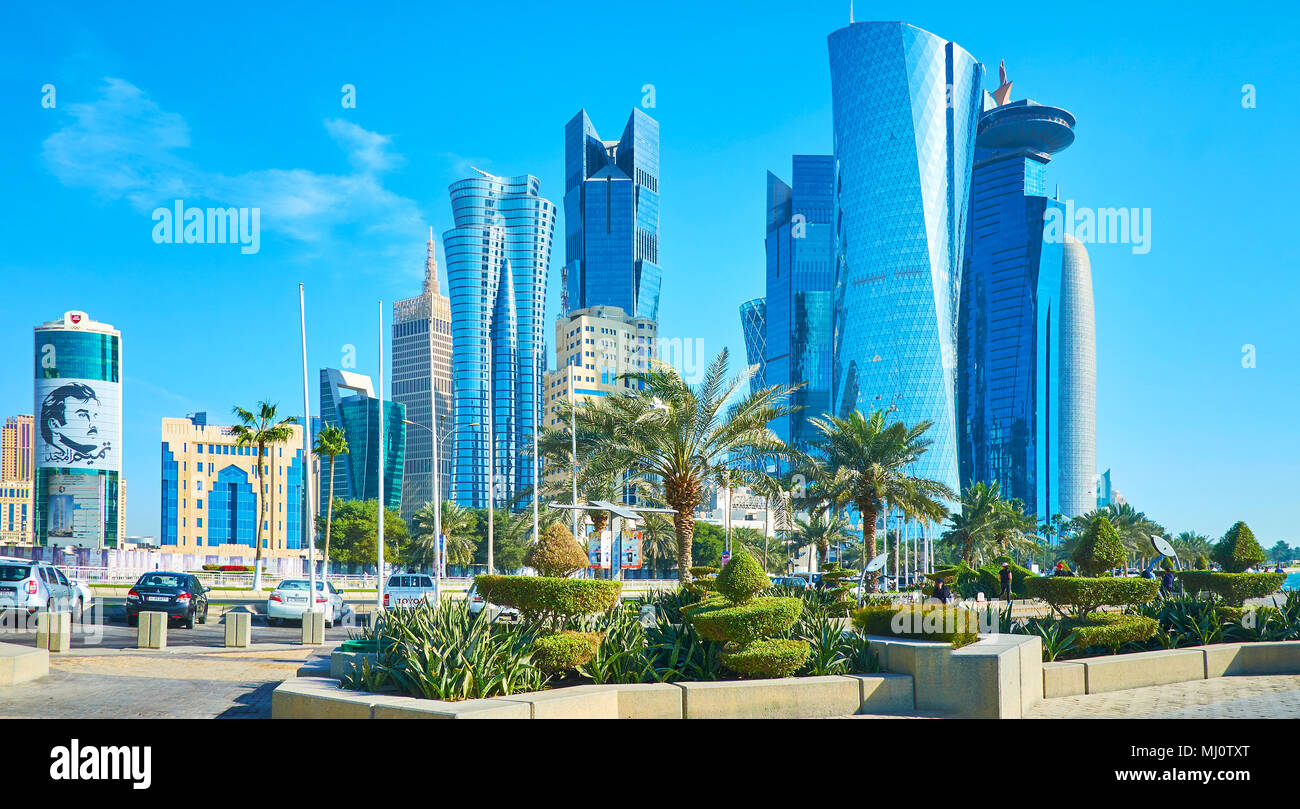 DOHA, QATAR - FEBRUARY 13, 2018: Al The beautiful park with lush palms ...