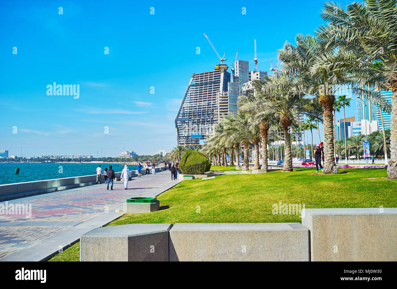 DOHA, QATAR - FEBRUARY 13, 2018: The daily seaside walk on Al Corniche ...