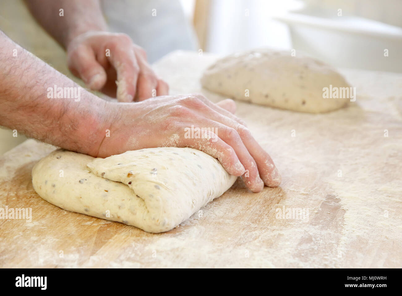 Making dough by male hands at bakery Stock Photo - Alamy
