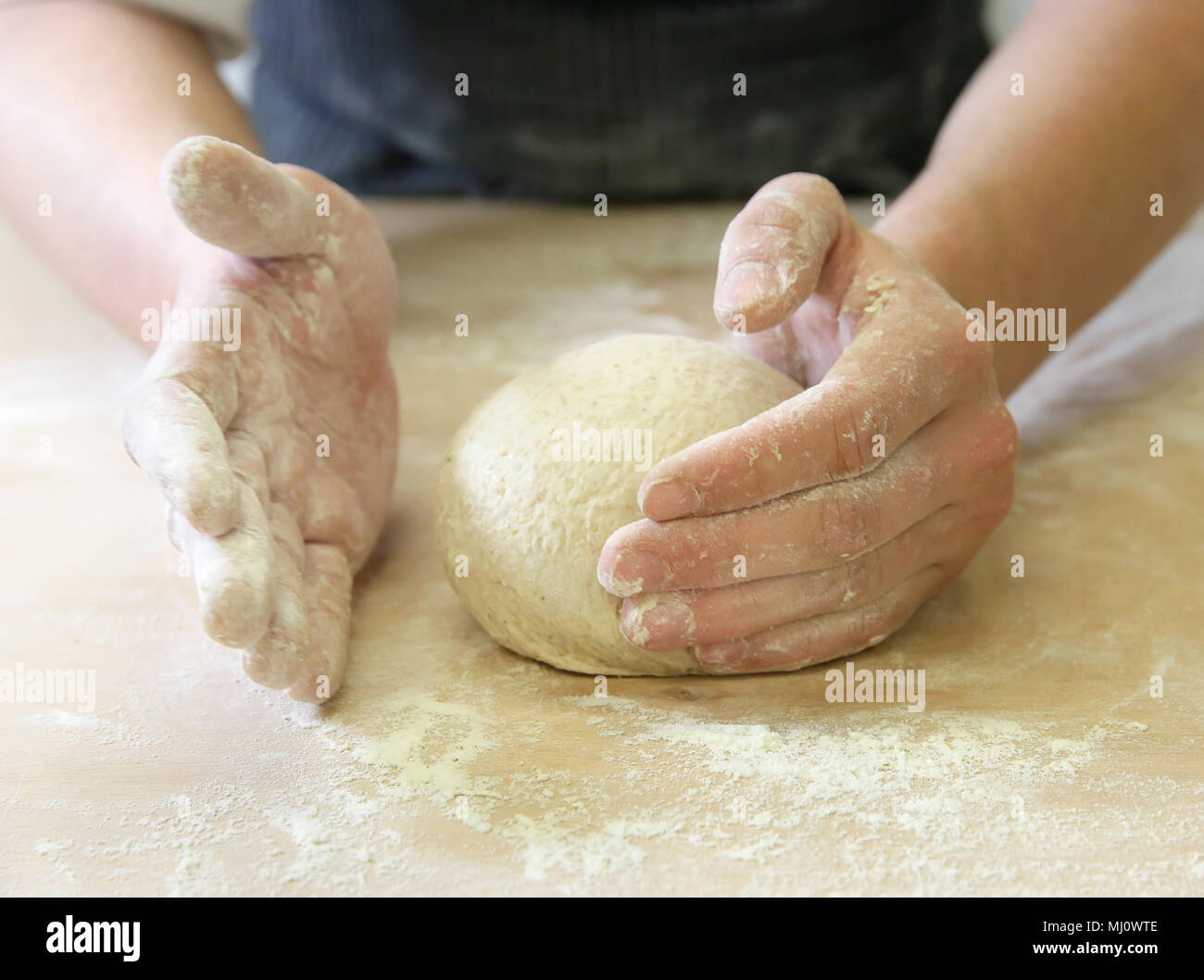 Making dough by male hands at bakery Stock Photo - Alamy