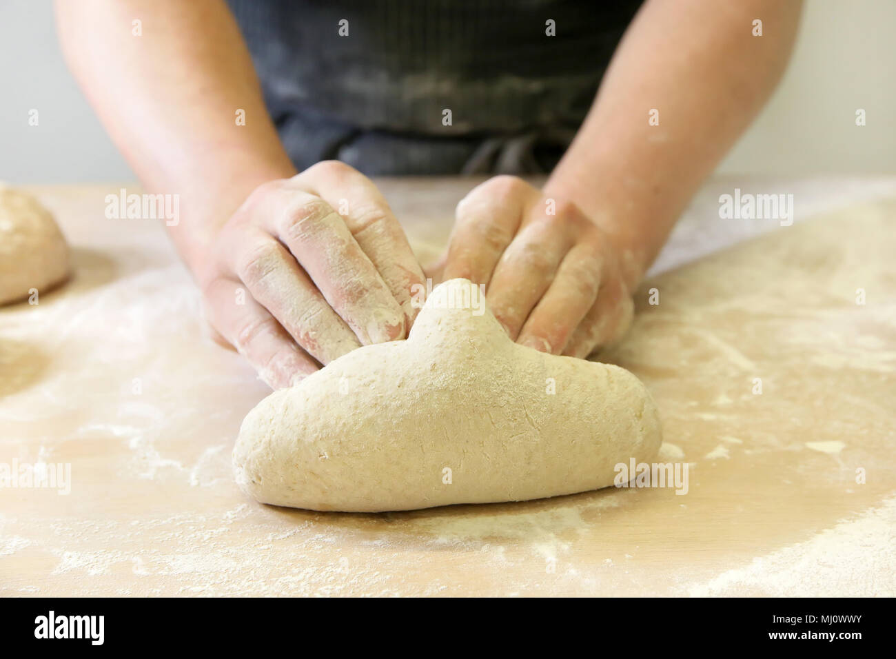 Making dough by male hands at bakery Stock Photo - Alamy