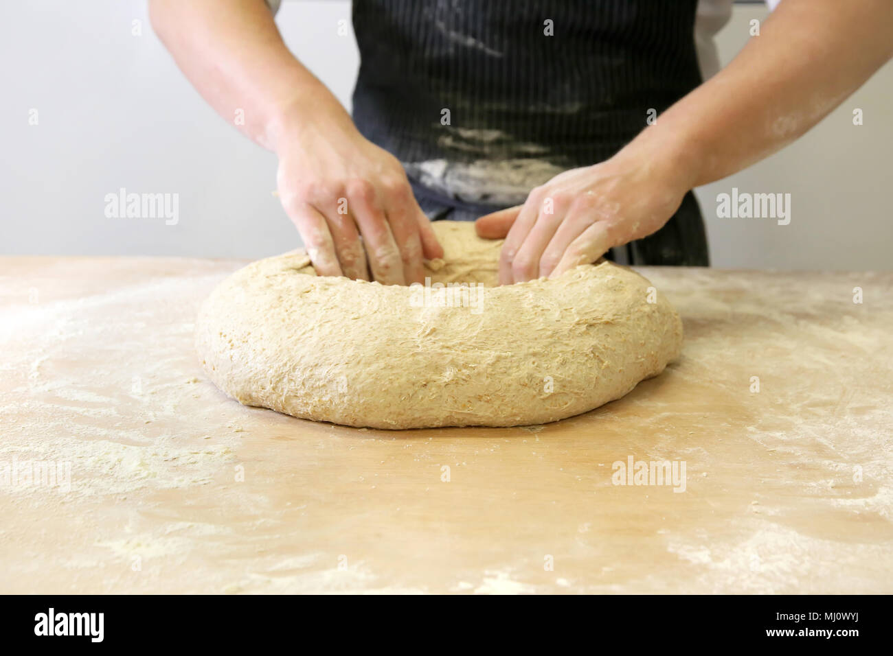 Making dough by male hands at bakery Stock Photo - Alamy
