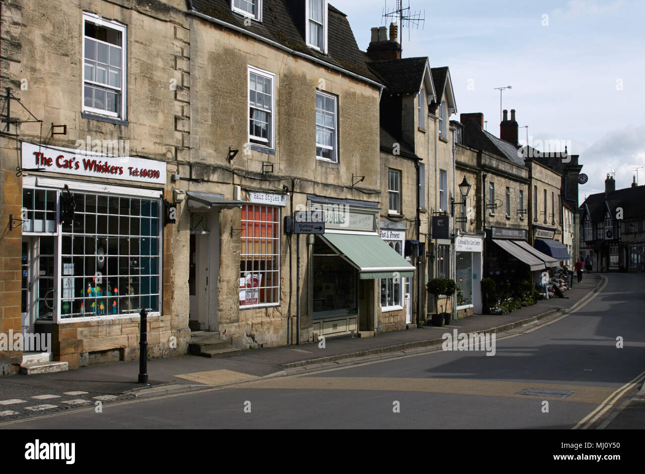 Shops on the high street of the Cotswold town of Winchcombe ...