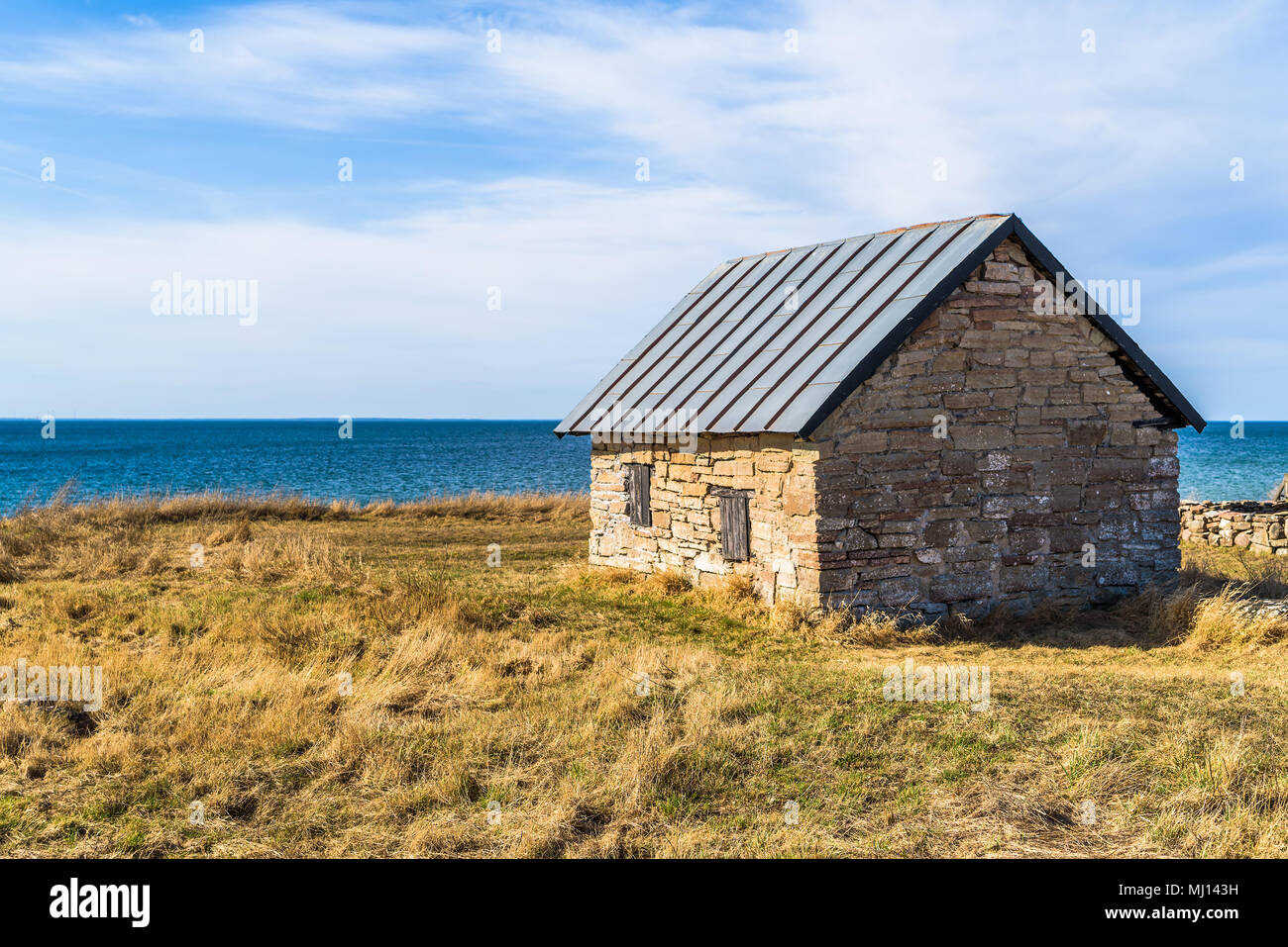 Limestone shed with metal roof on the coast of Oland, Sweden Stock ...