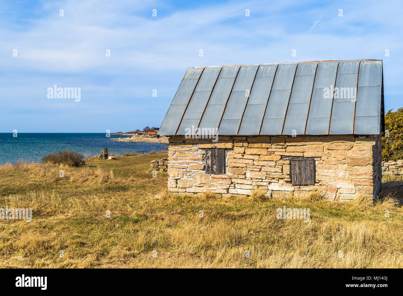 Limestone shed with metal roof on the coast of Oland, Sweden Stock ...