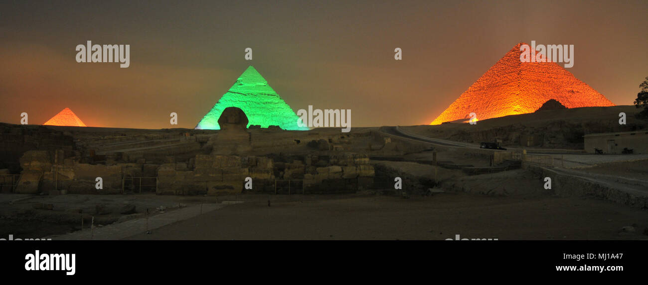 Cairo, Egypt -- The Great Pyramids of Giza at night in vibrant colors ...