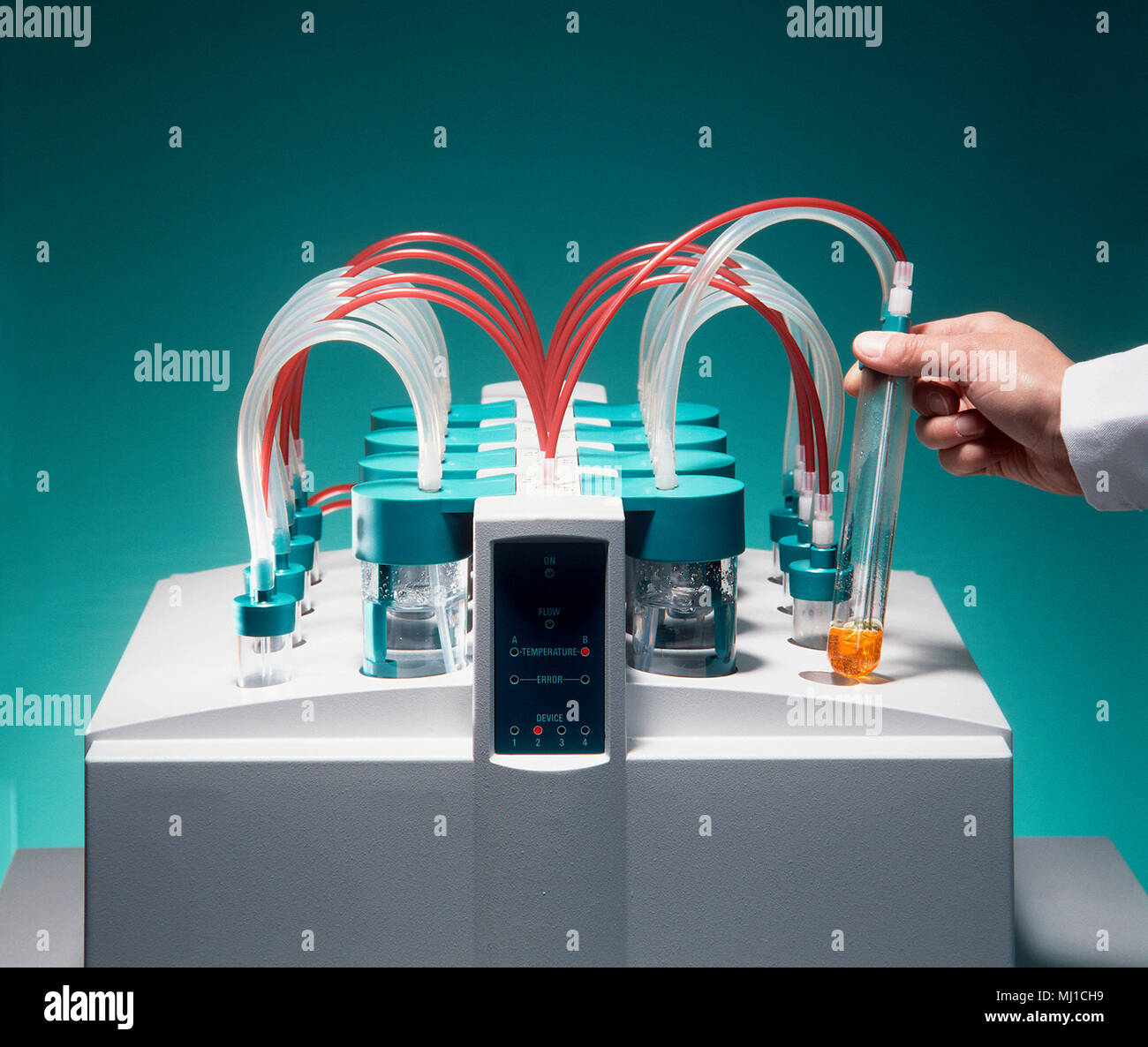 Hands pipette research test tube hi-res stock photography and images ...