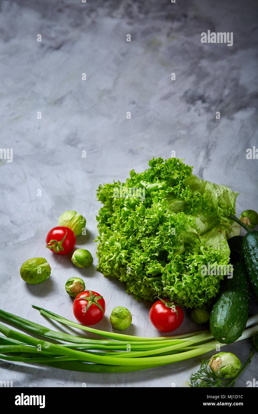Fresh vegetables still life over white textured background, close-up ...