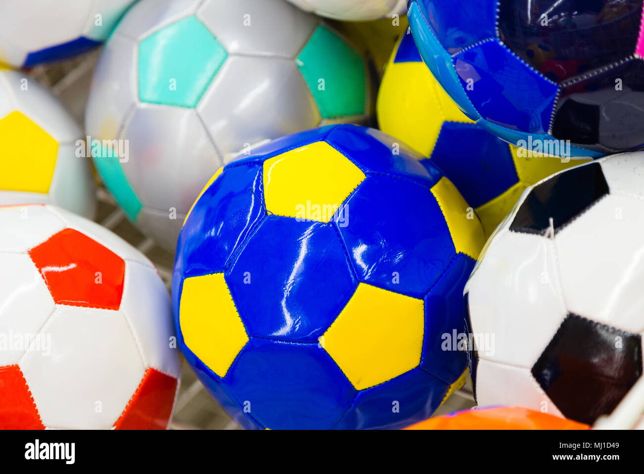 Colored soccer balls in the supermarket on sale Stock Photo - Alamy