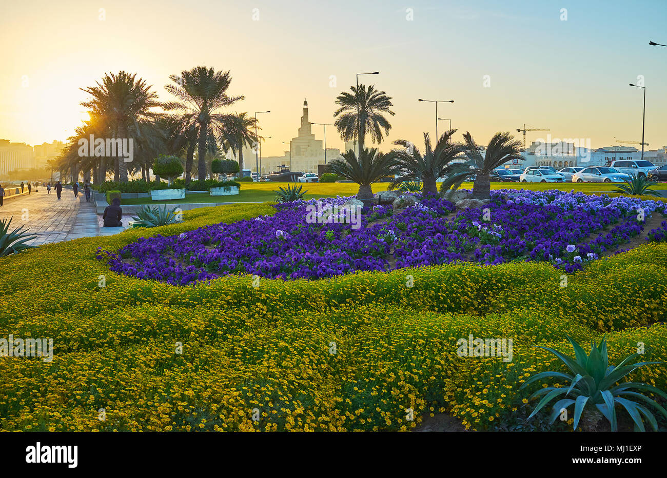 Enjoy the beautiful sunrise in seaside park of Doha with a view on ...