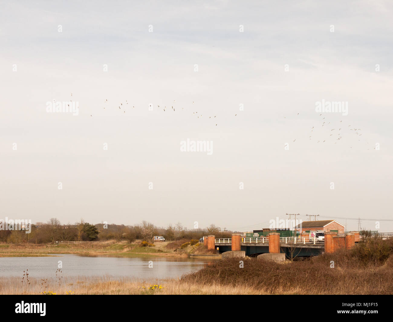 open stretch of water river stream country sky nature background bridge ...