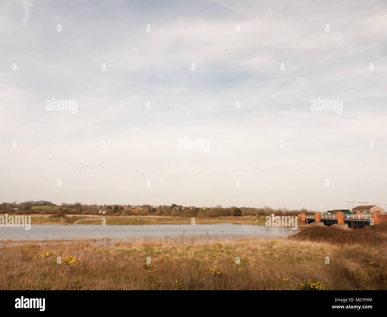 open stretch of water river stream country sky nature background bridge ...