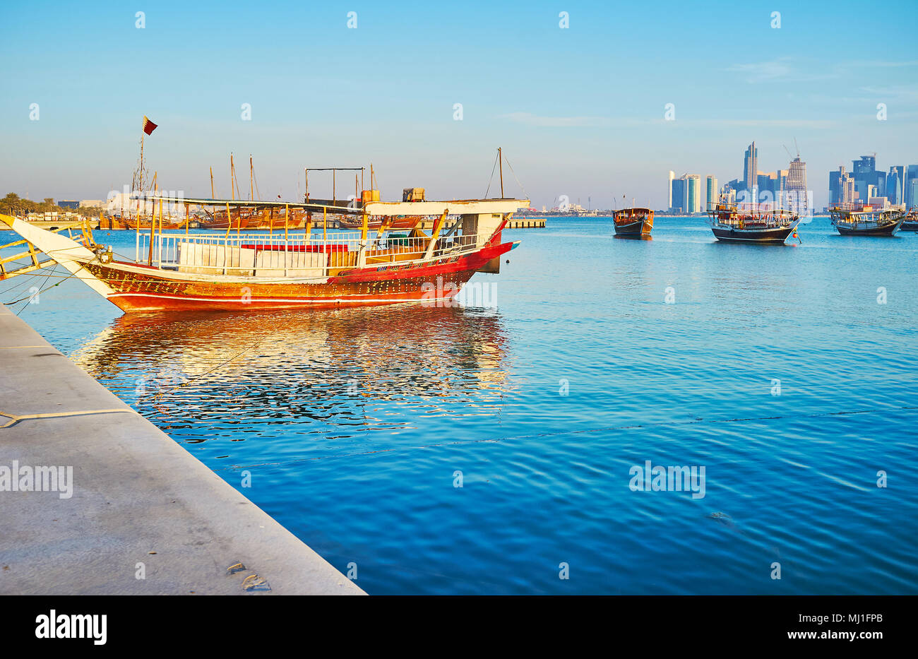 Romantic walk along the coast of Persian Gulf with a view on tourist ...