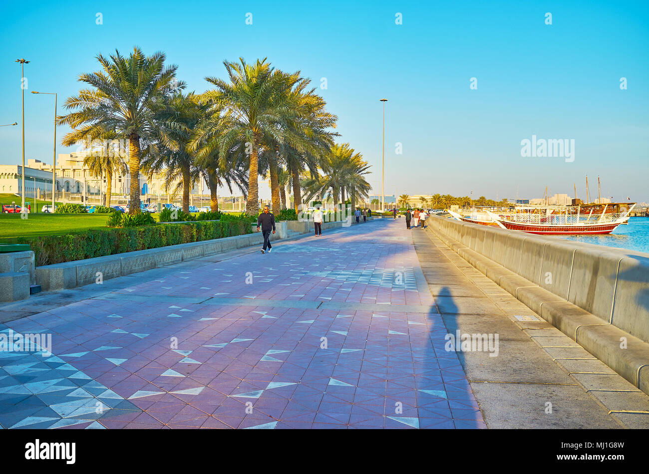 DOHA, QATAR - FEBRUARY 13, 2018: The morning in Corniche promenade with ...