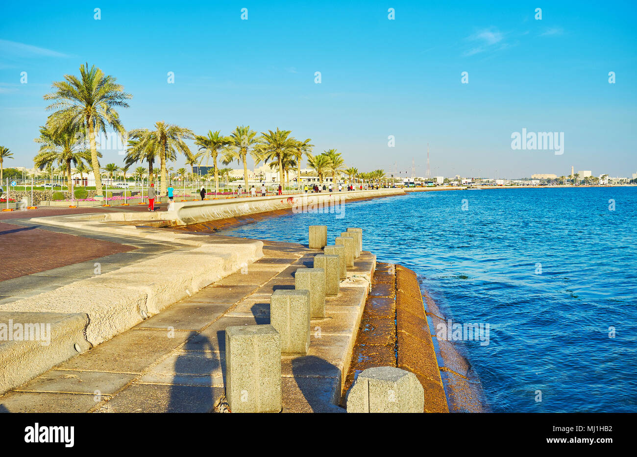 The walk along the shore of Persian Gulf, the Corniche promenade of ...