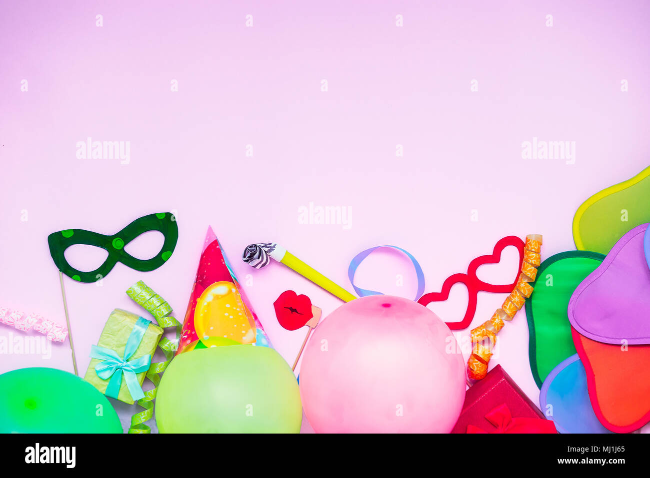 Light pink Festive background with party tools and decoration - baloons ...