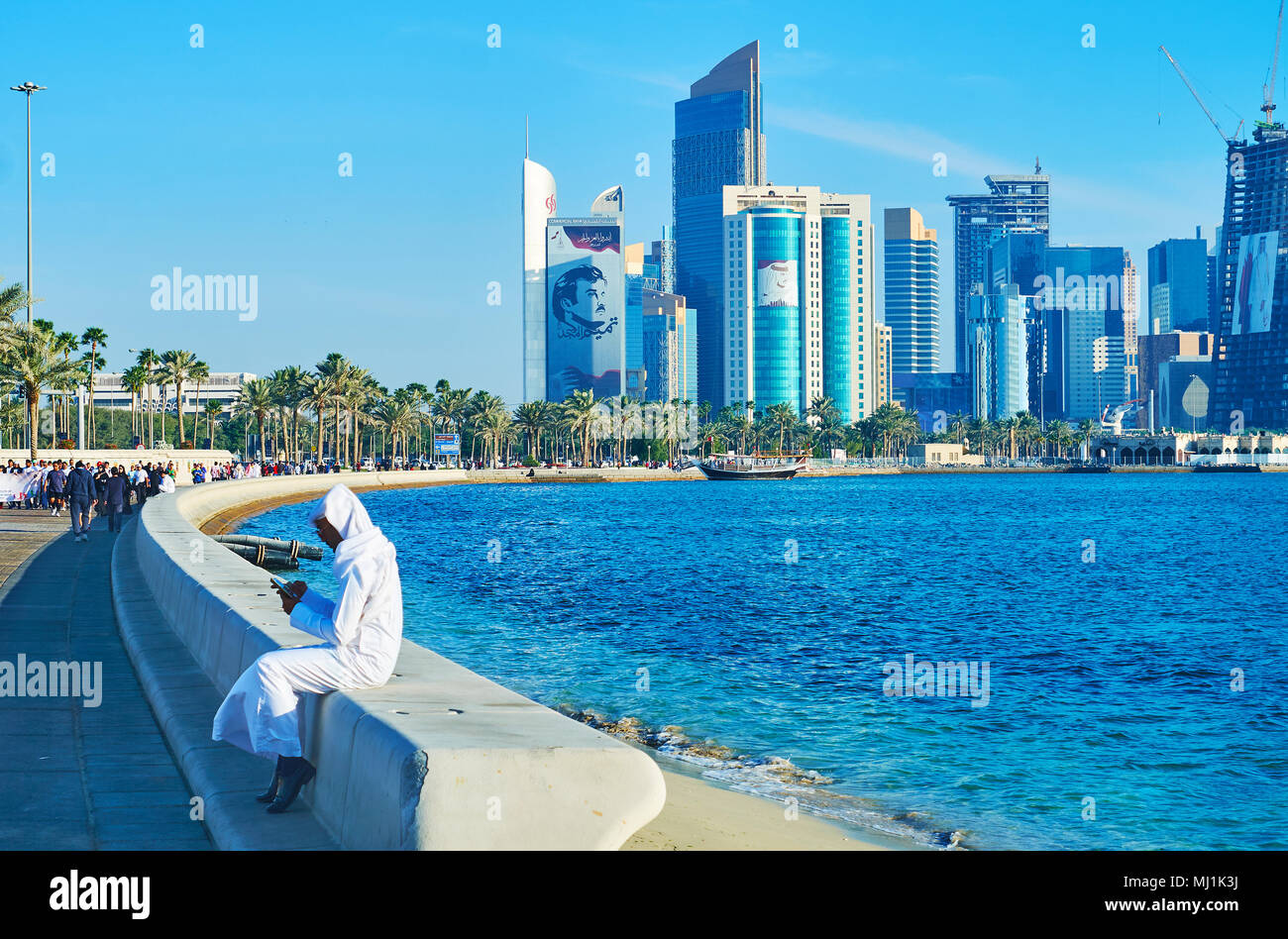 DOHA, QATAR - FEBRUARY 13, 2018: The Corniche promenade is popular ...