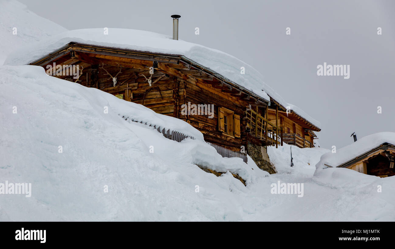 Alpine house covered with snow hi-res stock photography and images - Alamy