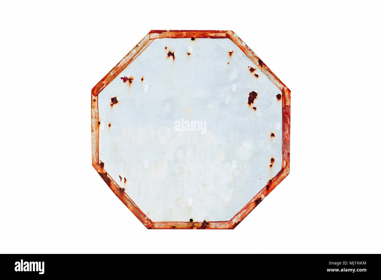 Rusty and grungy white and red old road empty traffic sign in octagon ...