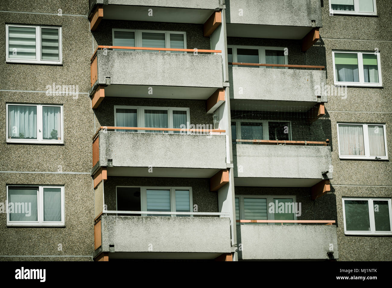 Poor living area old building with balconies Stock Photo - Alamy