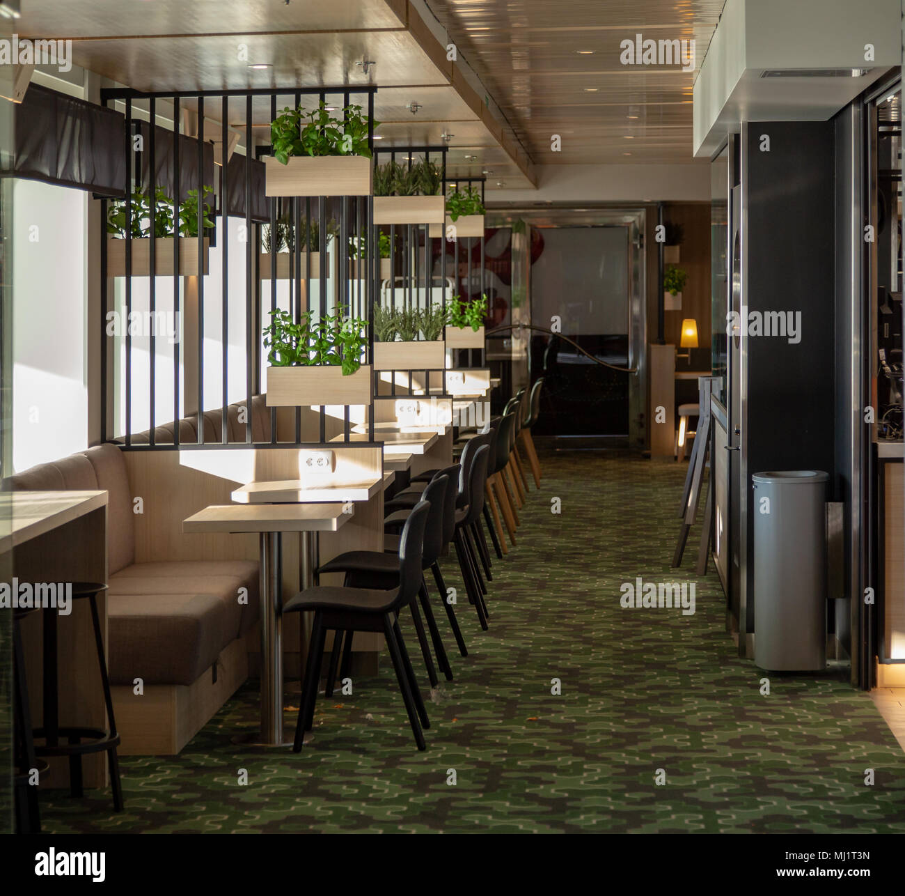 Modest but trendy and small restaurant interior shot that has its ...