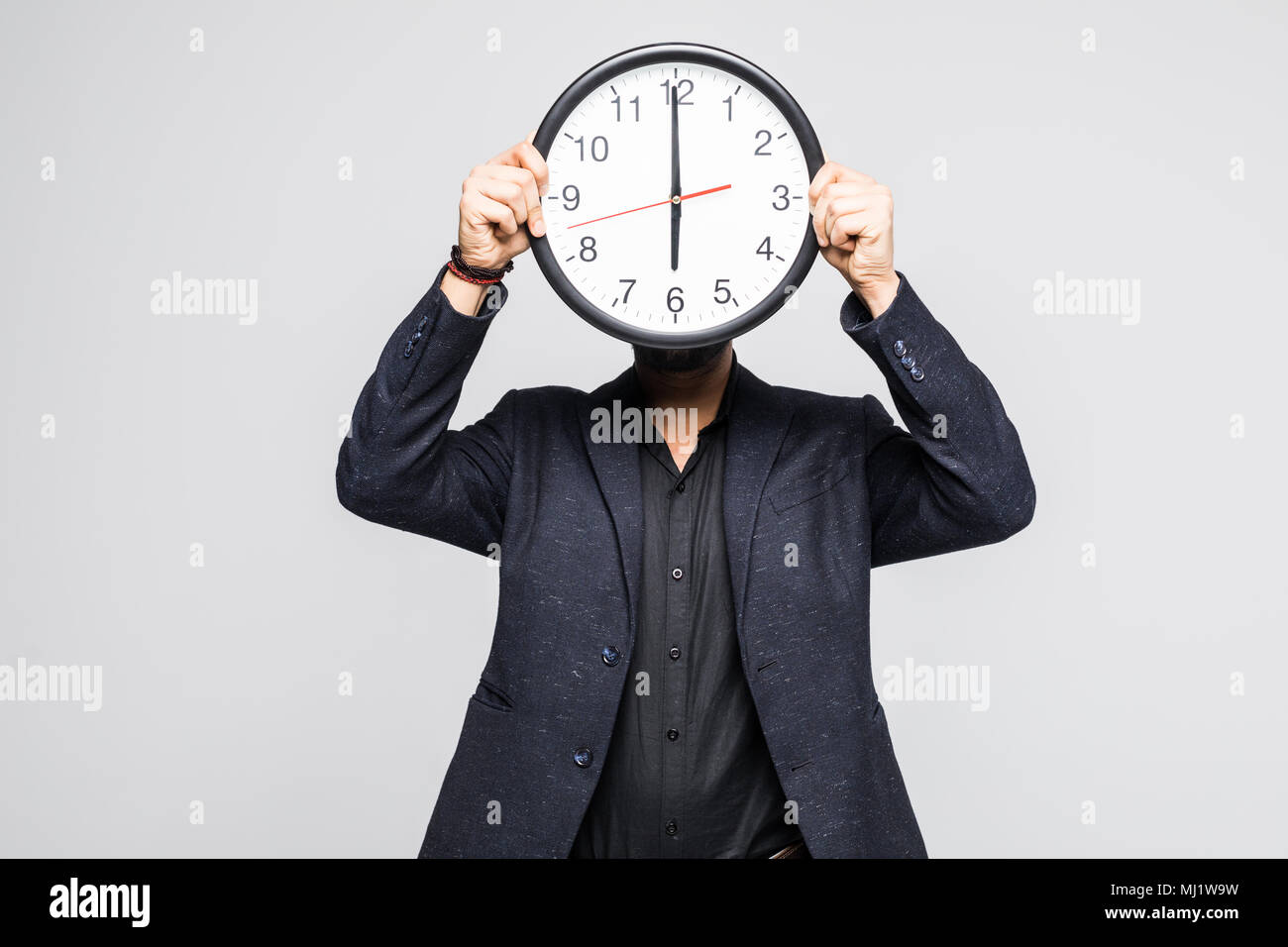 Portrait of a indian business man with clock isolated on white Stock ...