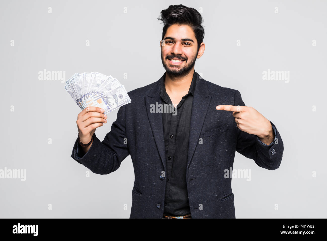 Closeup portrait of super happy excited successful young man holding ...