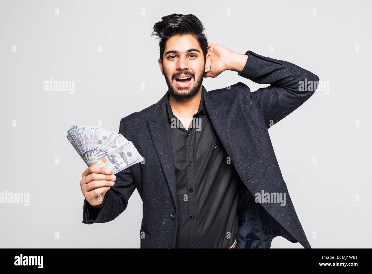 Closeup portrait of super happy excited successful young man holding ...
