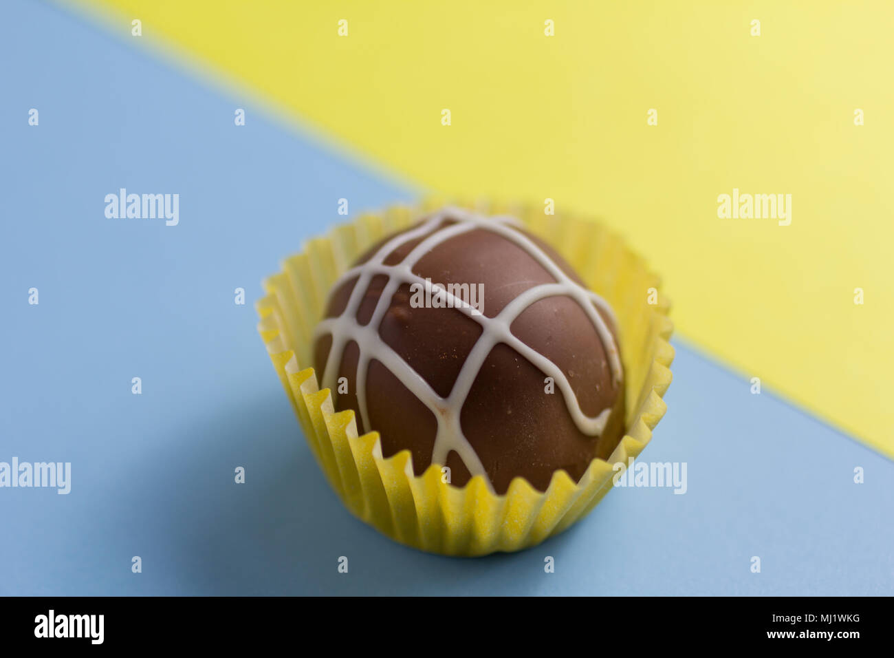 Homemade chocolate truffle. Delicious sweet temptation. One candy ball ...