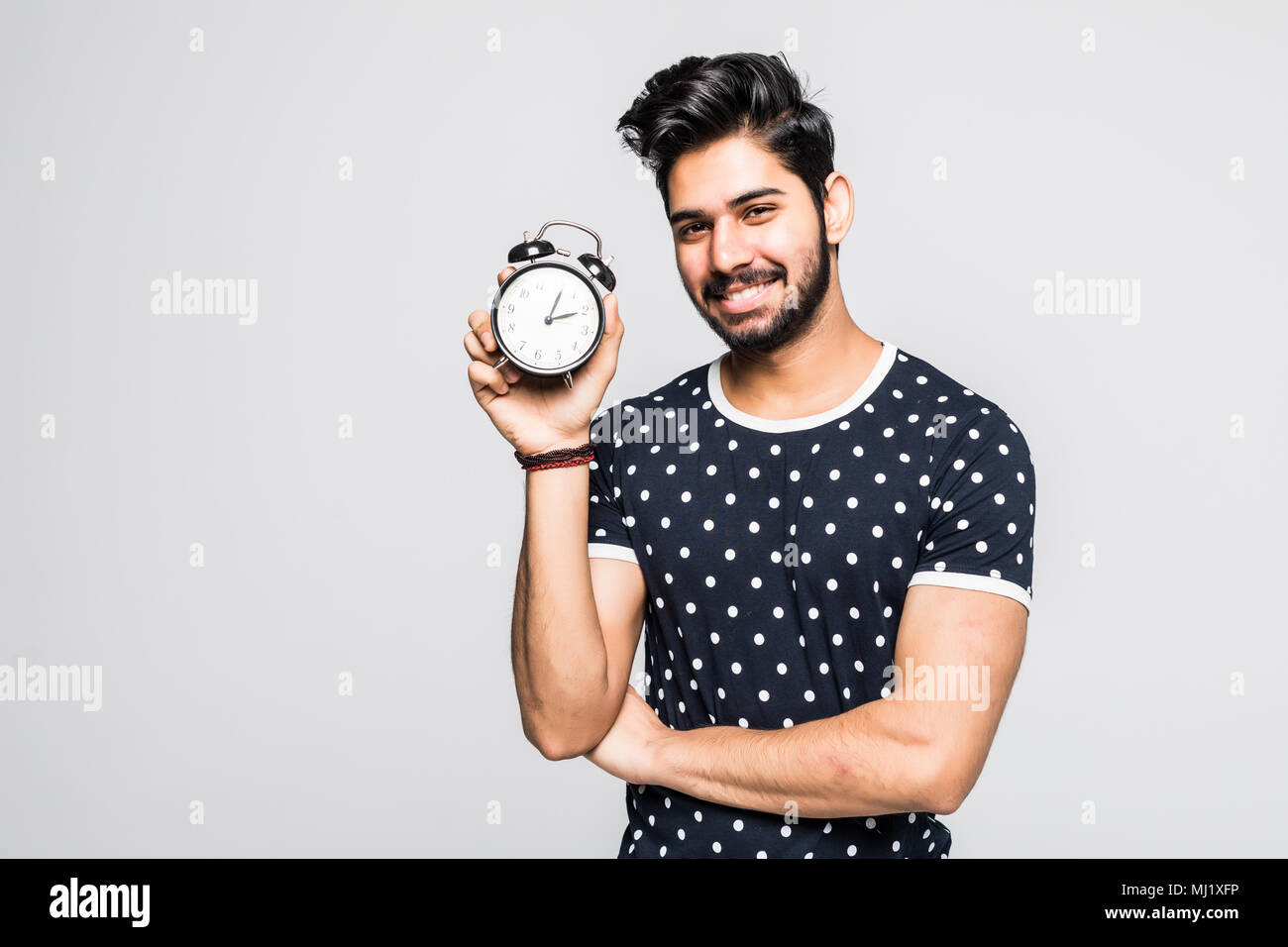Portrait of a business man with clock. Isolated on white background ...