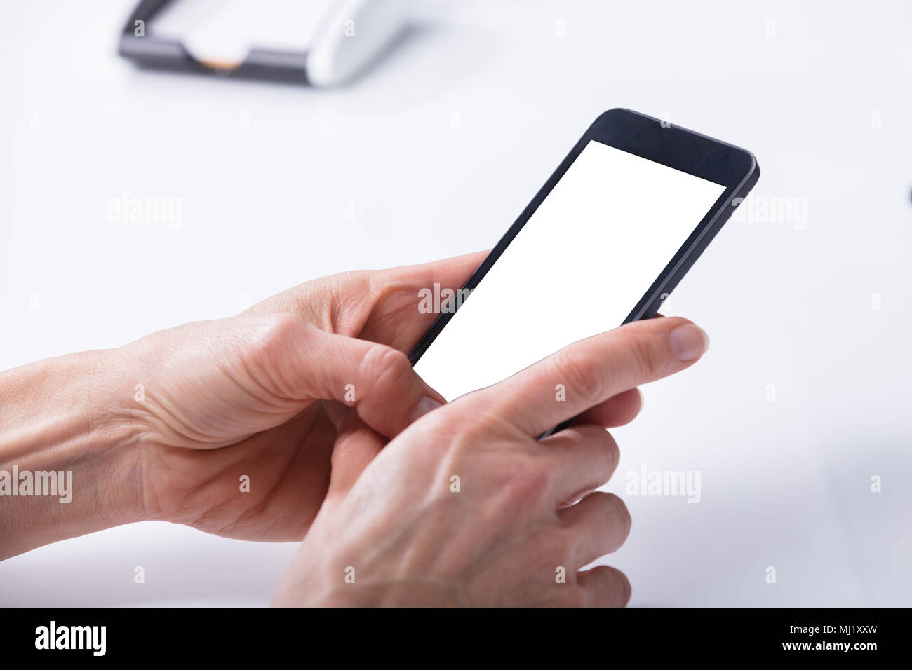 Female hand using cell phone hi-res stock photography and images - Alamy