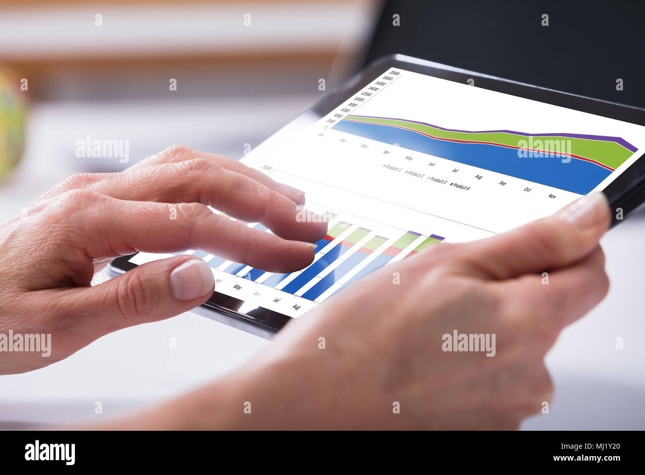 Human Hand Holding Digital Tablet With Graph On Its Screen Stock Photo ...