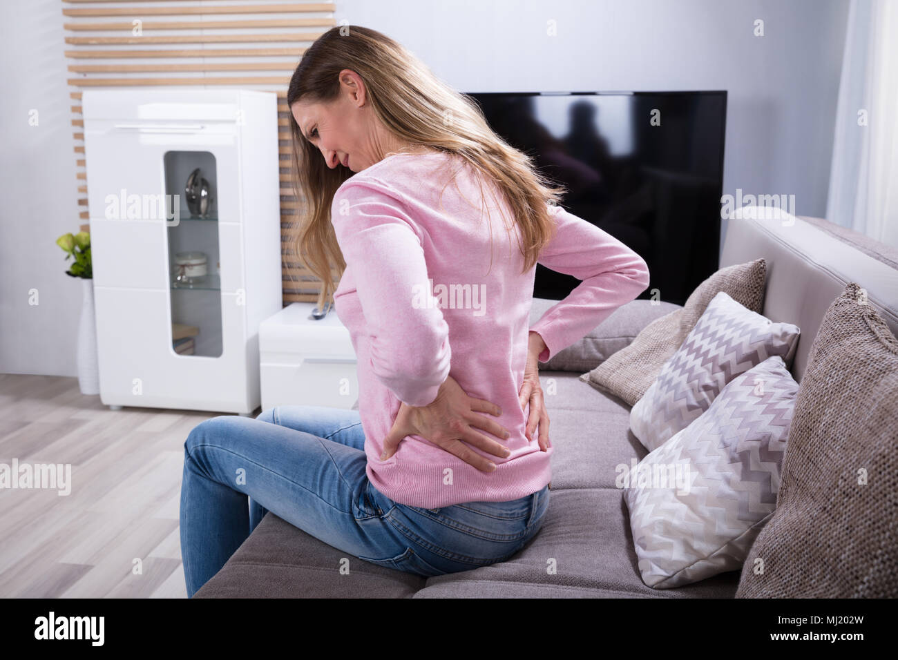 Woman backache mature hi-res stock photography and images - Alamy