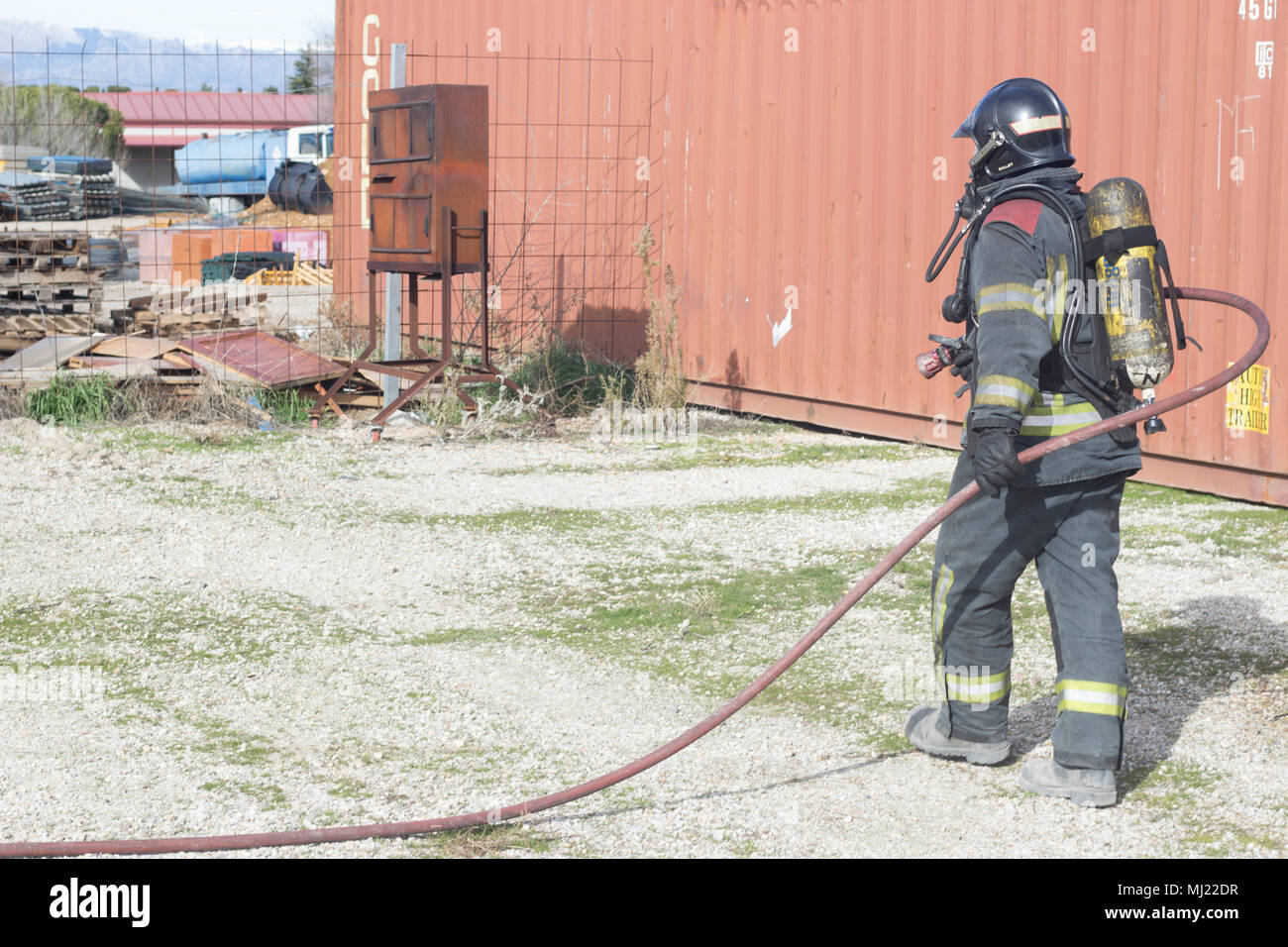 Firefighter putting out fire training station extinguisher backdraft ...