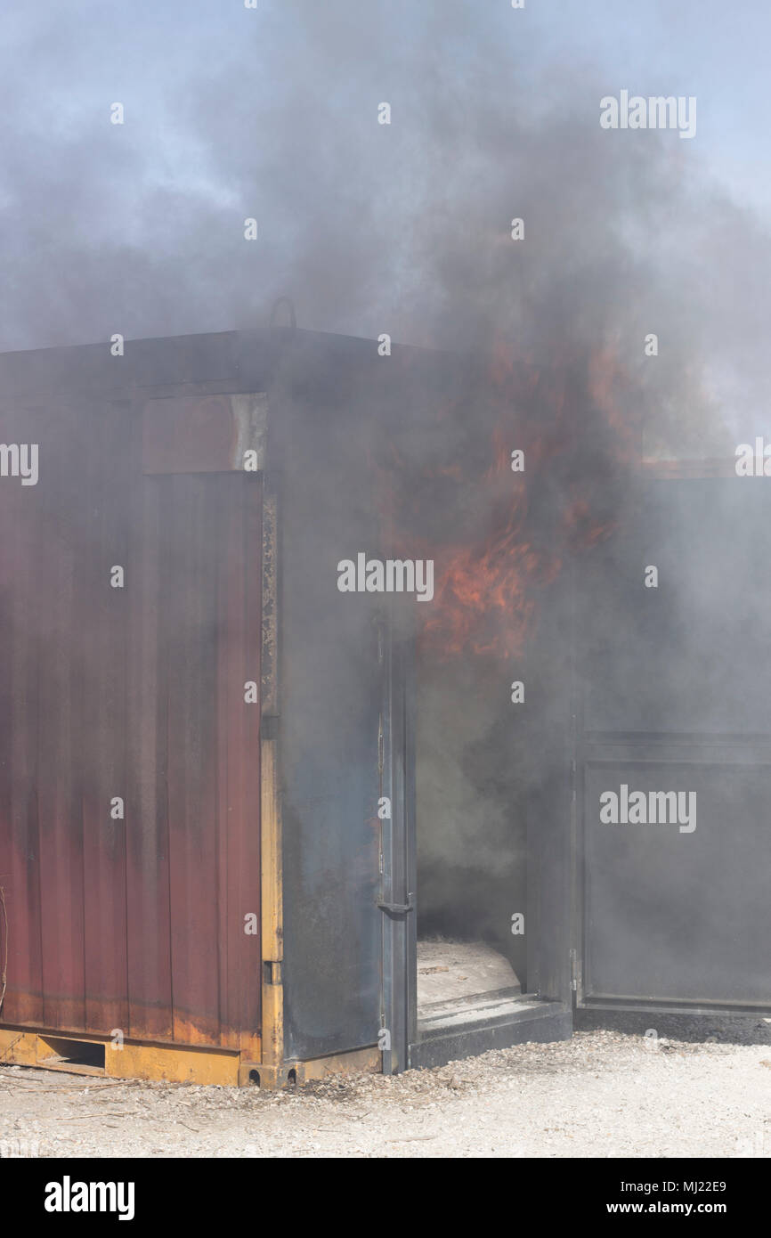 Firefighter putting out fire training station extinguisher backdraft ...