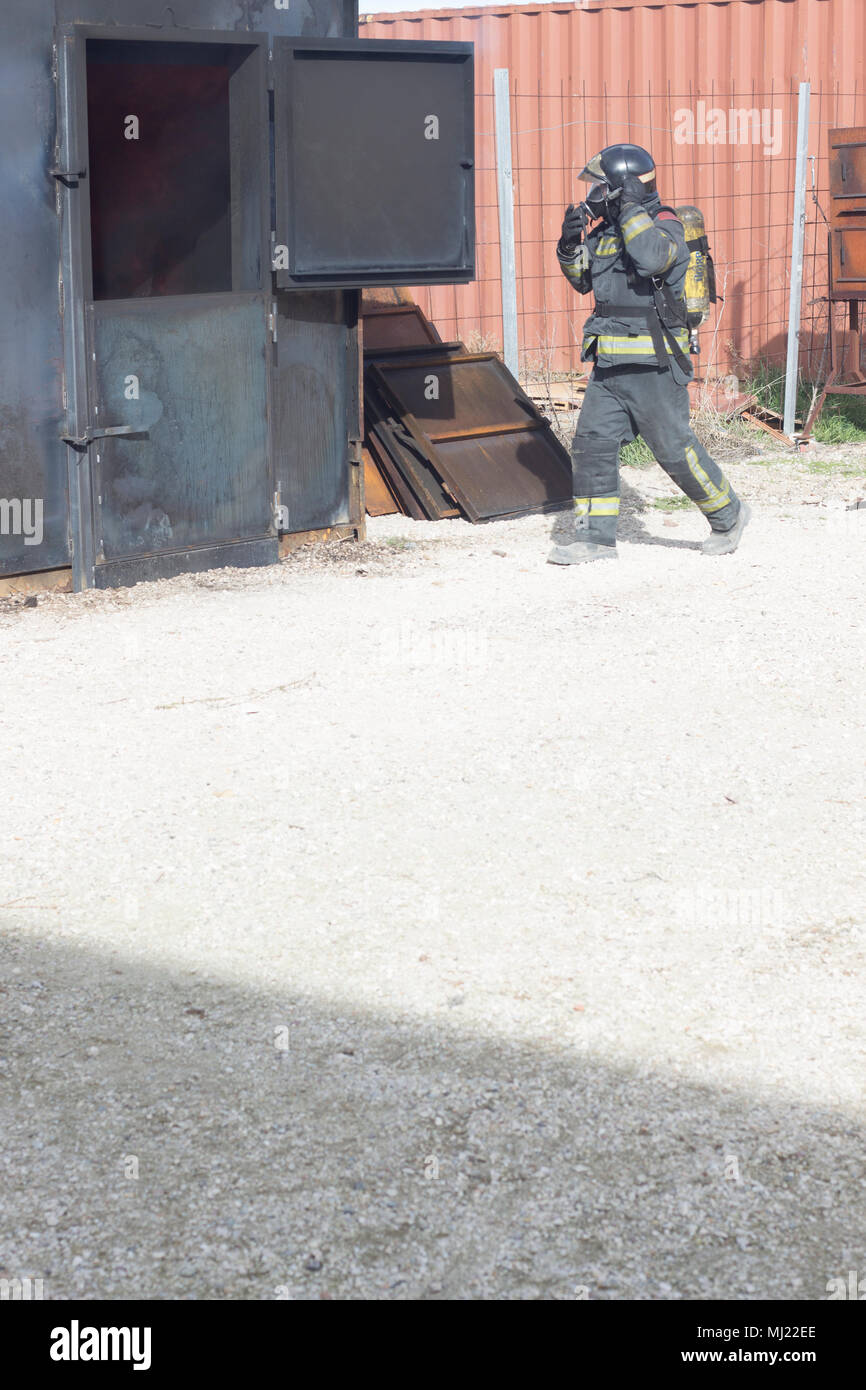 Firefighter putting out fire training station extinguisher backdraft ...