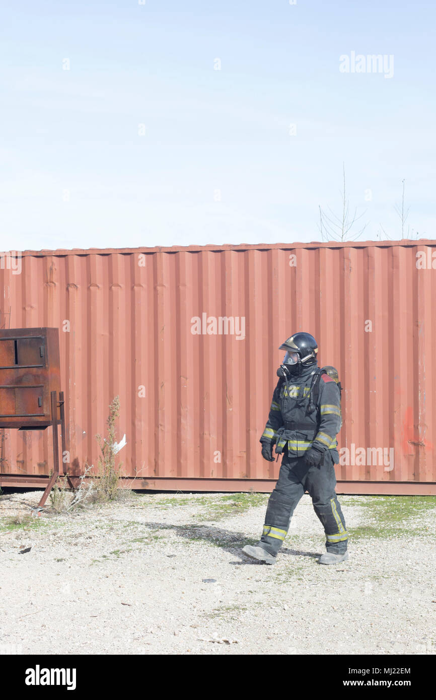 Firefighter putting out fire training station extinguisher backdraft ...