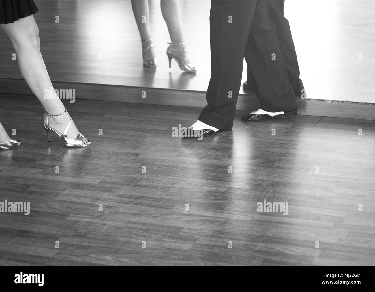 Ballroom dance couple of dancers and teachers in studio school dancing ...